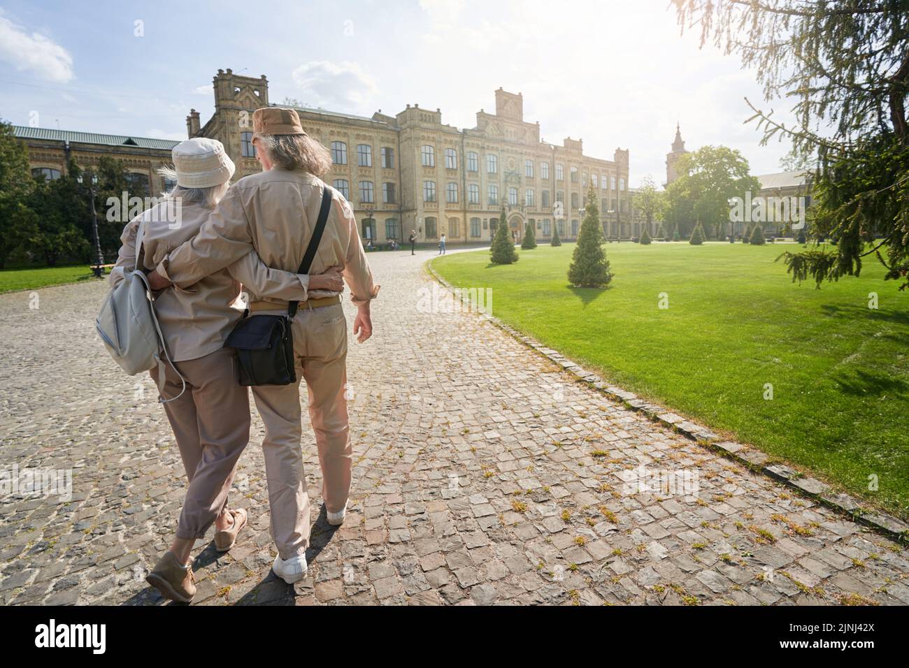 Two elderly people walking on the path Stock Photo - Alamy