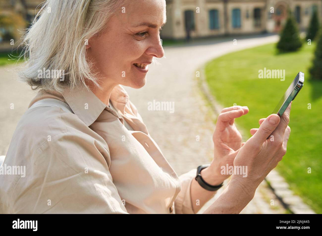 Smartphone mobile cell phone using reading texting checking looking app hi-res stock photography ...