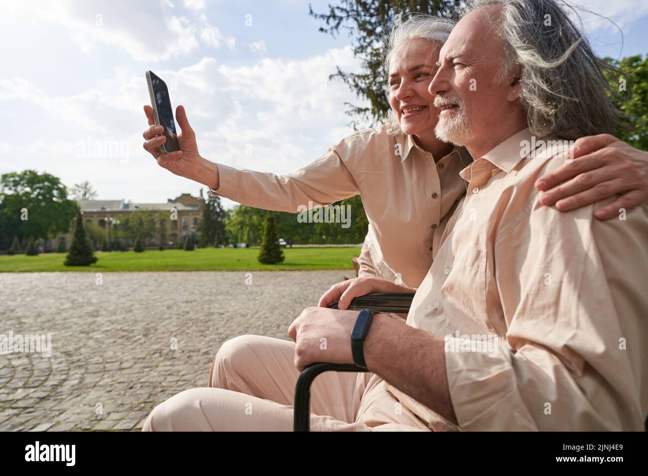 Positive delighted people taking picture on telephone Stock Photo - Alamy