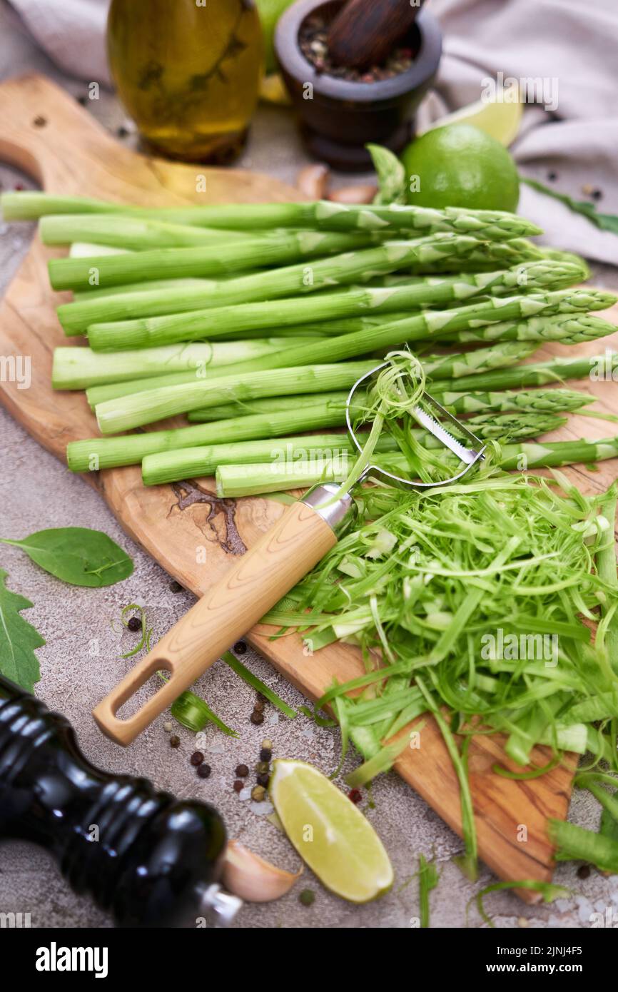 Green organic natural Asparagus on wooden cutting board at kitchen ...