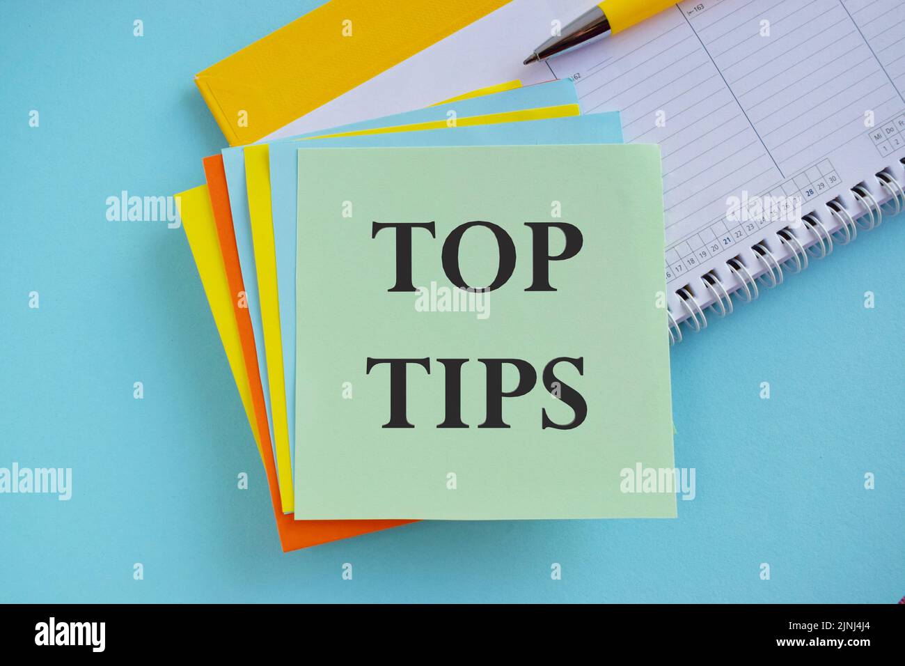 The phrase Top Tips text on sticker note as a reminder, Business ...