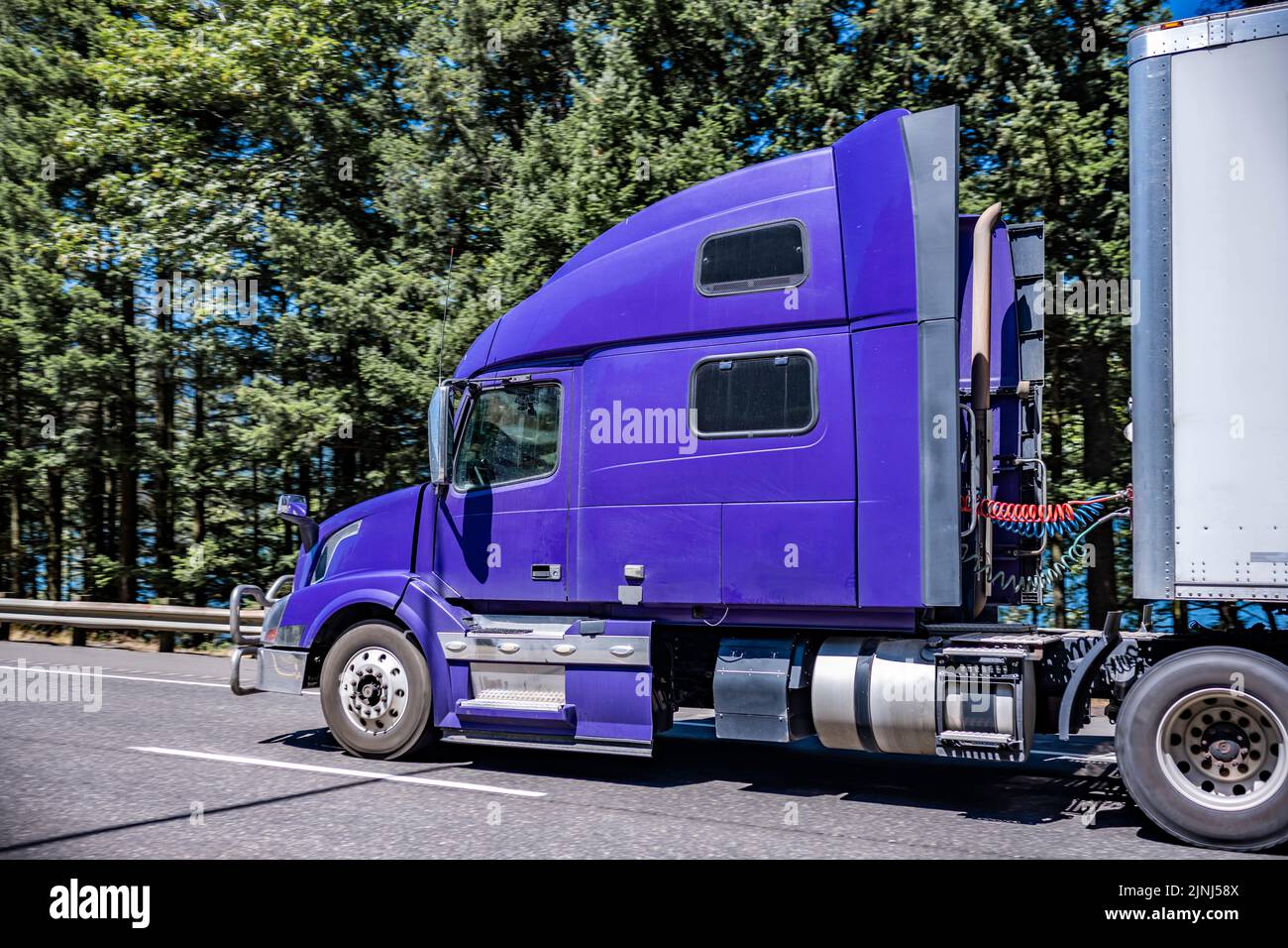 Ultramarine bonnet industrial big rig semi truck with truck driver cab ...