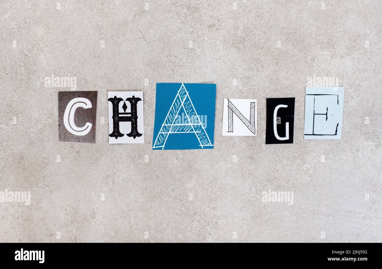 Change, written with lettering from magazine clippings on mottled grey ...