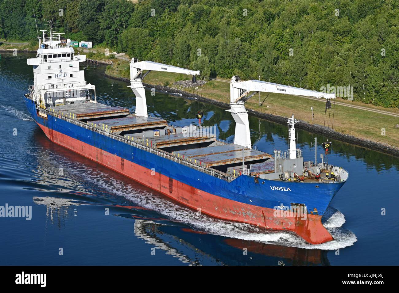 General Cargo Ship UNISEA passing the Kiel Canal Stock Photo - Alamy