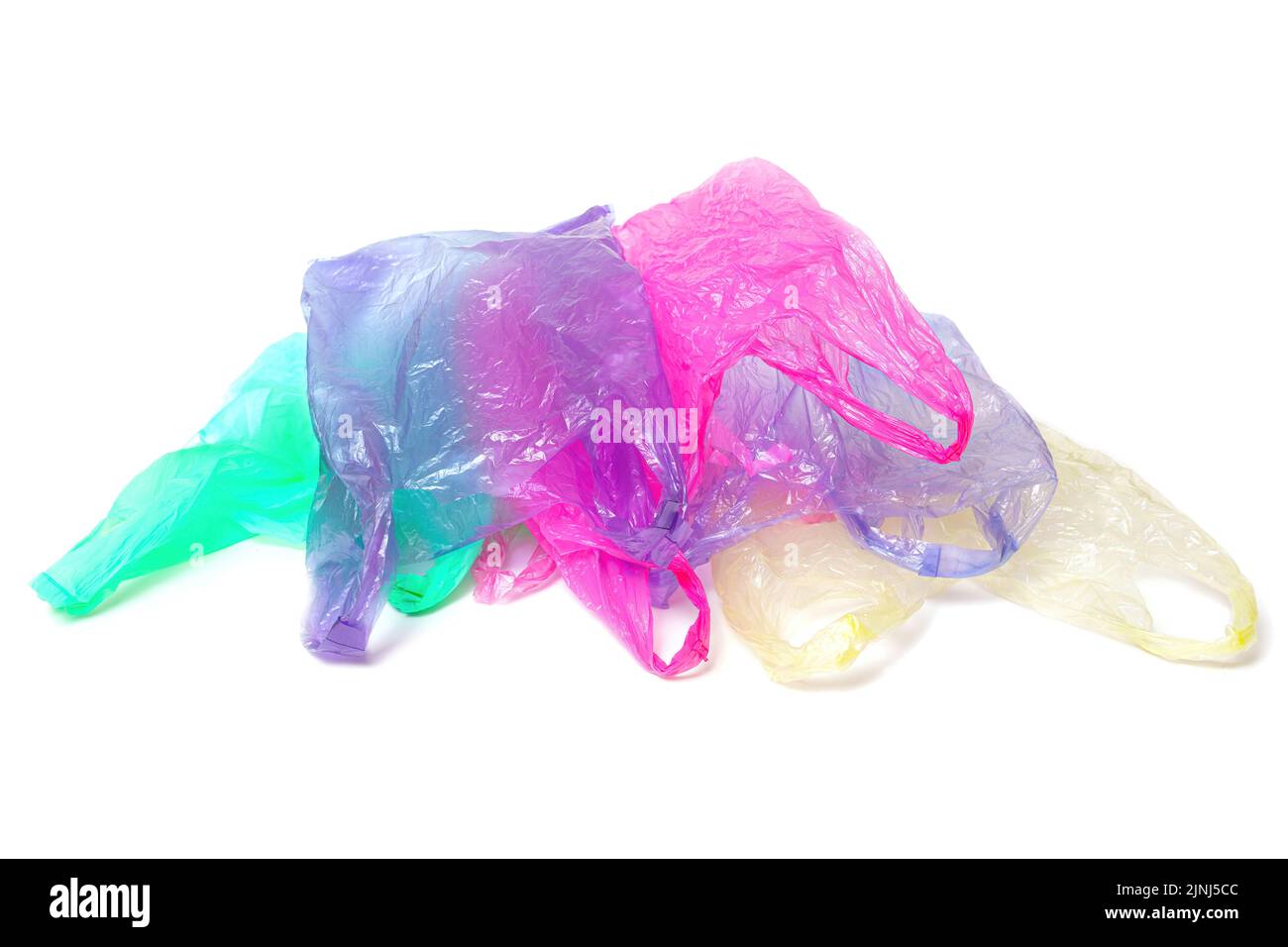 Heap of used multicolored disposable bags with handles isolated on ...