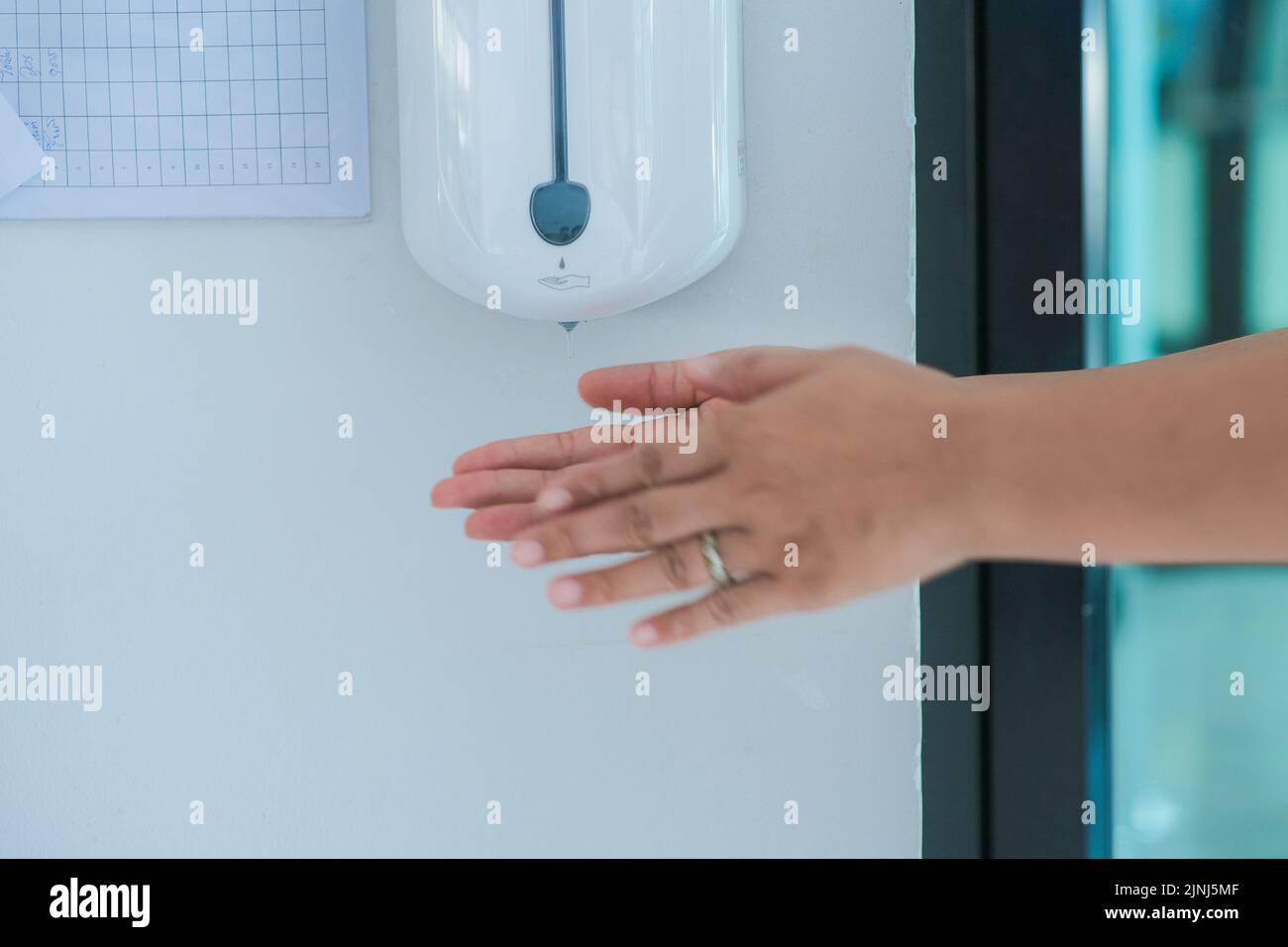 Hand wash with automatic alcohol gel hand cose up healthy concept Stock ...