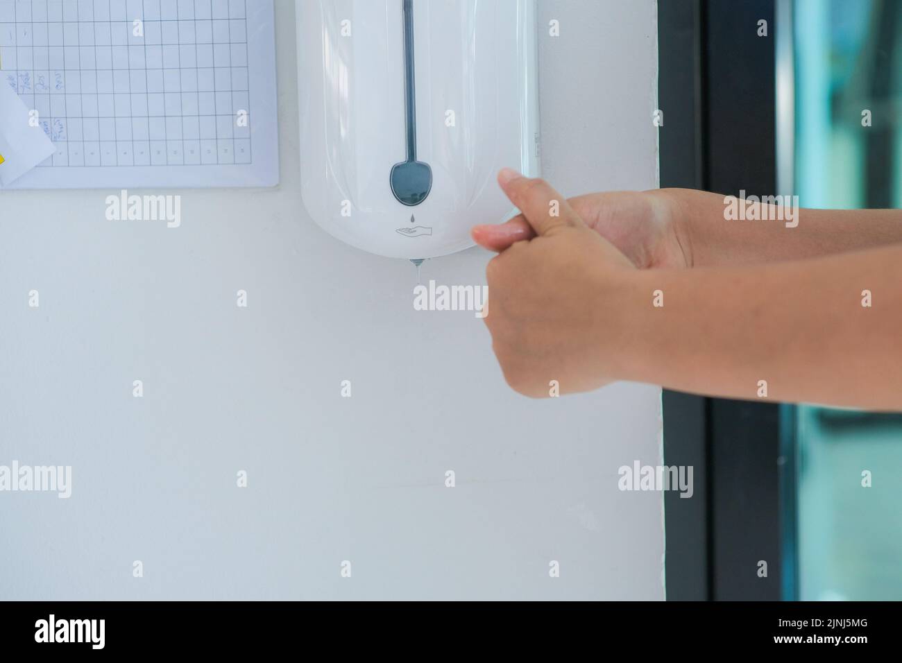 Hand wash with automatic alcohol gel hand cose up healthy concept Stock ...