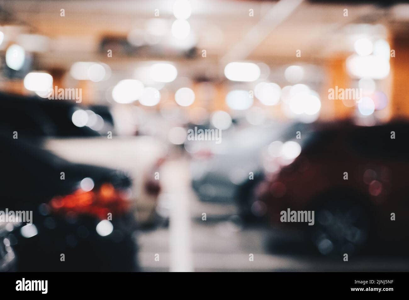 Car parking indoor of supermarket store blurred bokeh with tonned ...