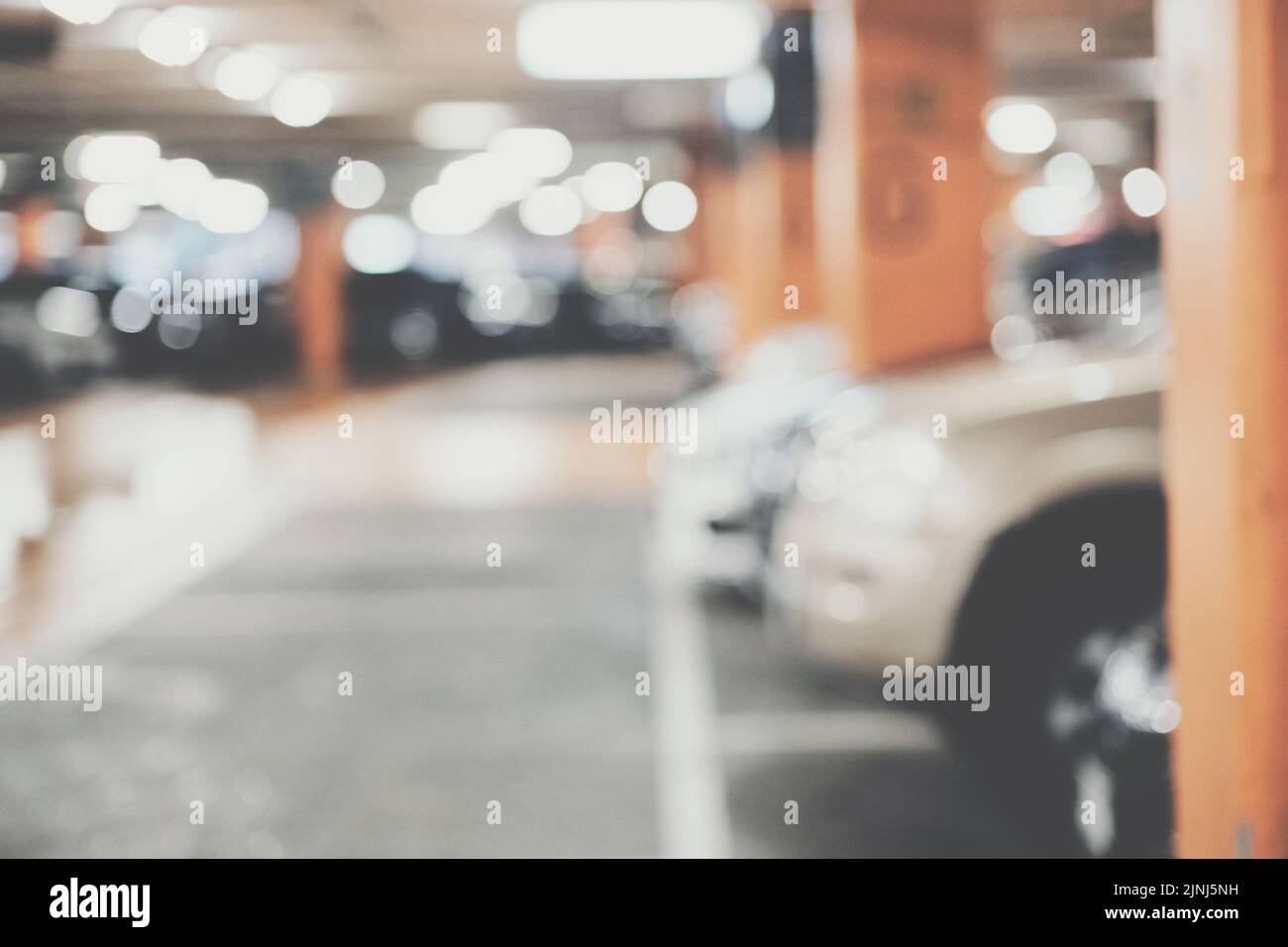Car parking indoor of supermarket store blurred bokeh with tonned ...