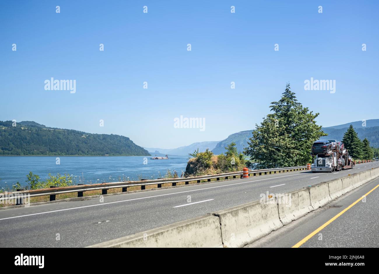 Industrial standard car hauler big rig semi truck transporting cars on ...