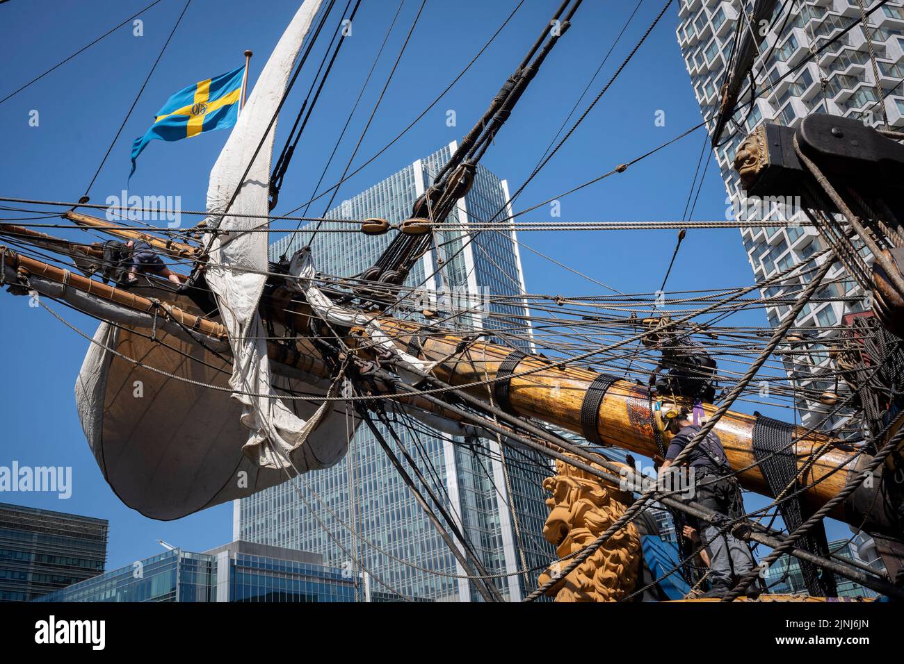 The crew of the replica sailing ship, Gotheborg, perform repairs and ...
