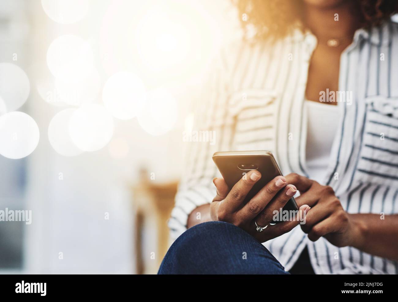 Closeup of woman hands holding, typing and using a phone to browse the ...