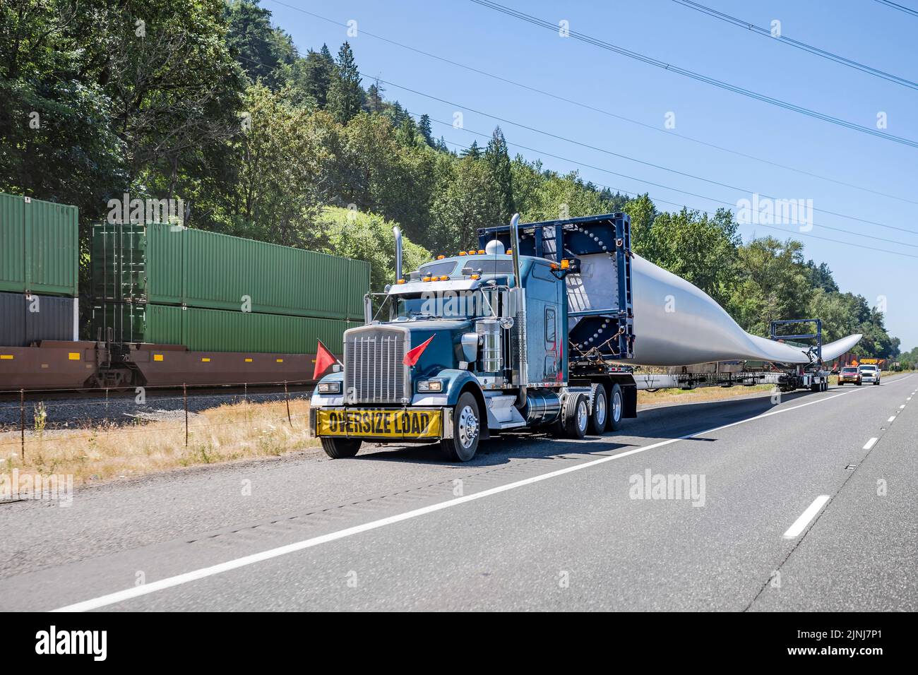 Powerful Big rig semi truck tractor with oversize load sign ...
