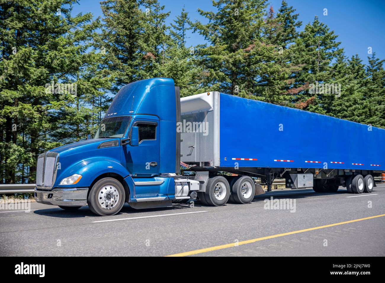 Industrial grade bonnet powerful day cab blue big rig semi truck ...