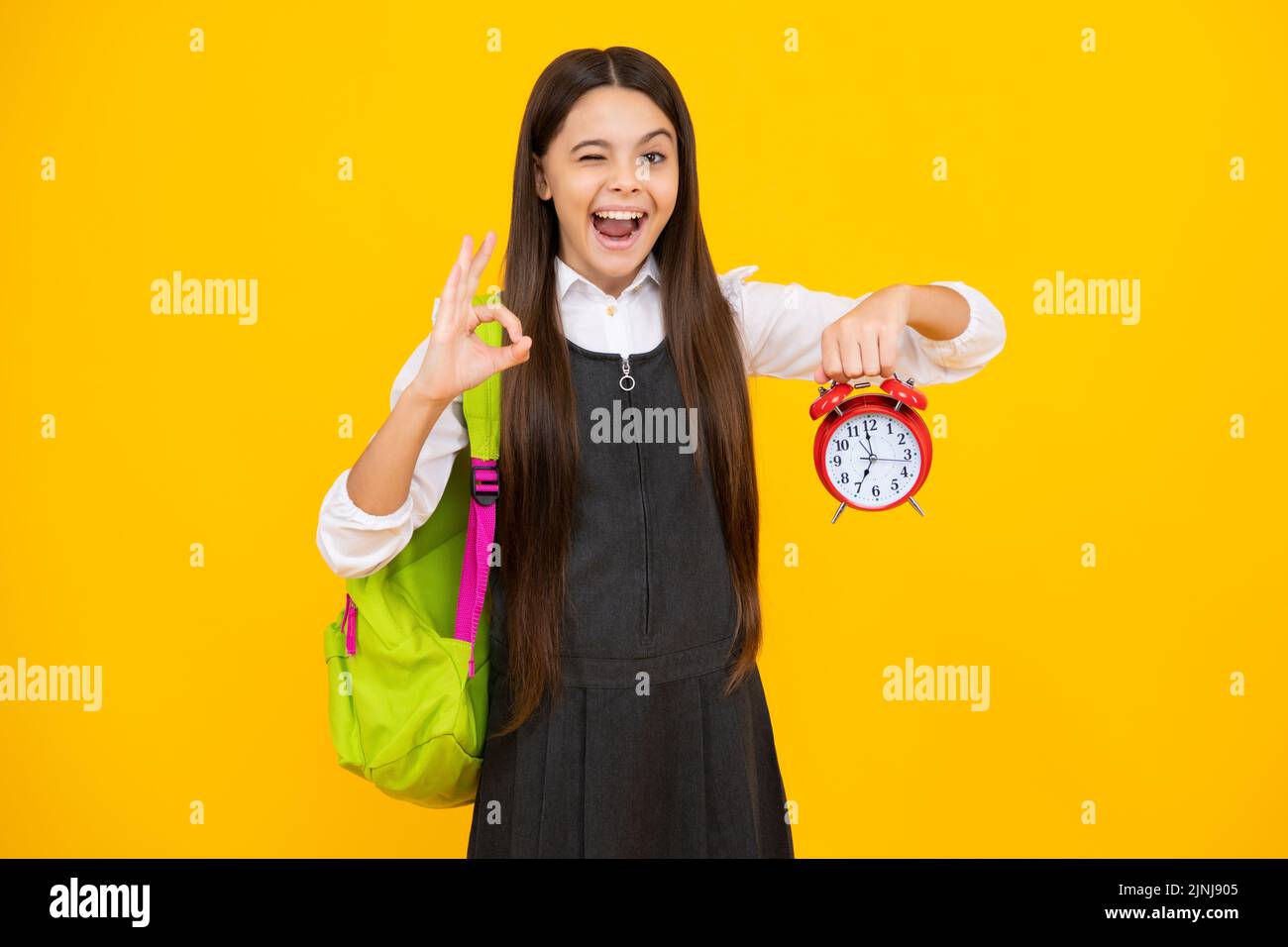 Funny face. Back to school. Teenager school girl with backpack hold ...