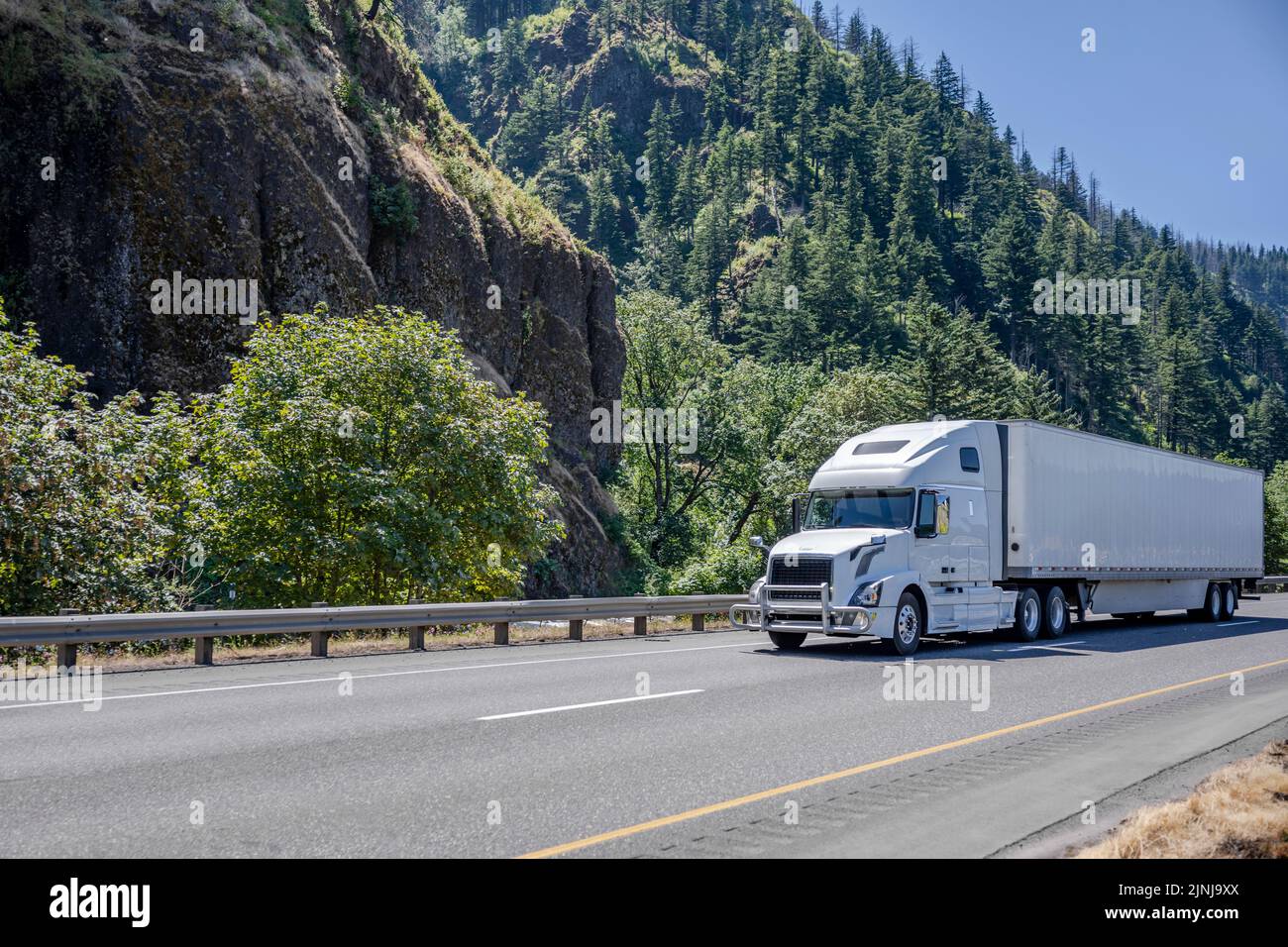 White industrial big rig semi truck with truck driver cab sleep ...