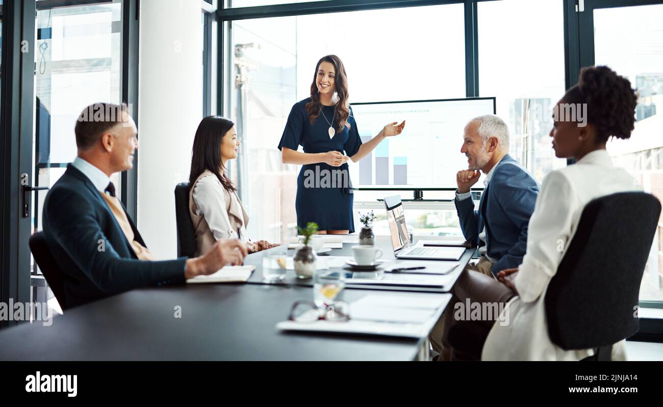 Business woman speaker in an investment meeting with financial data on ...