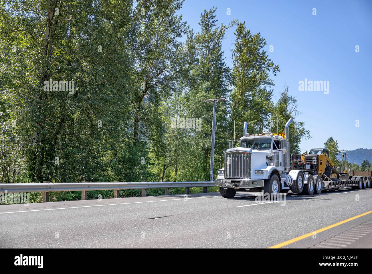 Industrial day cab big rig hauler semi truck with oversize load sign ...