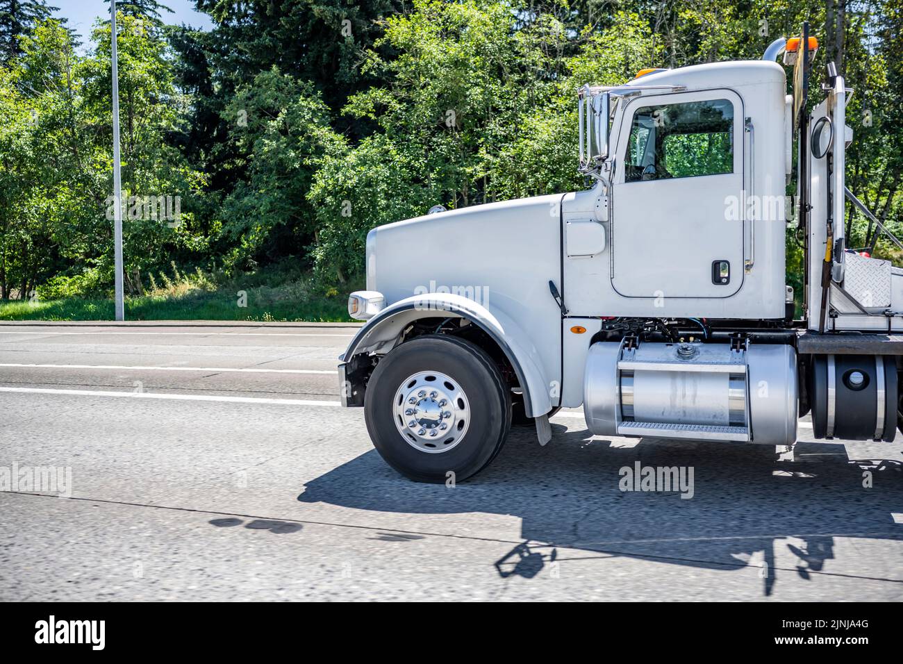 Industrial day cab big rig hauler semi truck with oversize load sign ...