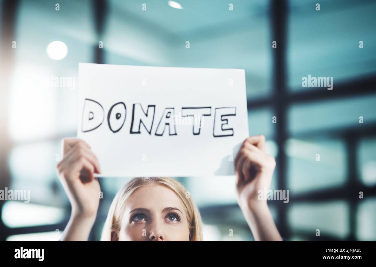 Donate, volunteer and give back to the community with a sign in the ...