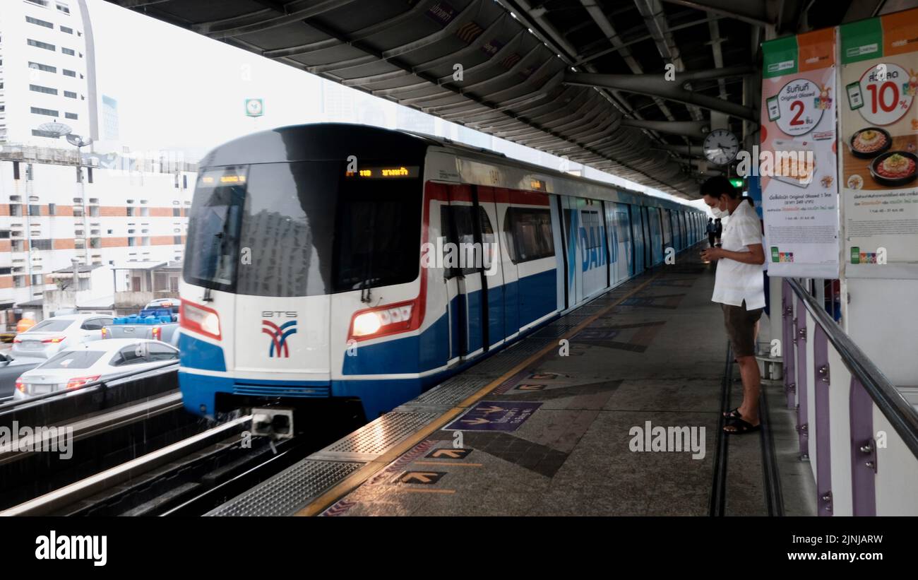 Man on BTS Skytrain Platform Bangkok Thailand Stock Photo - Alamy