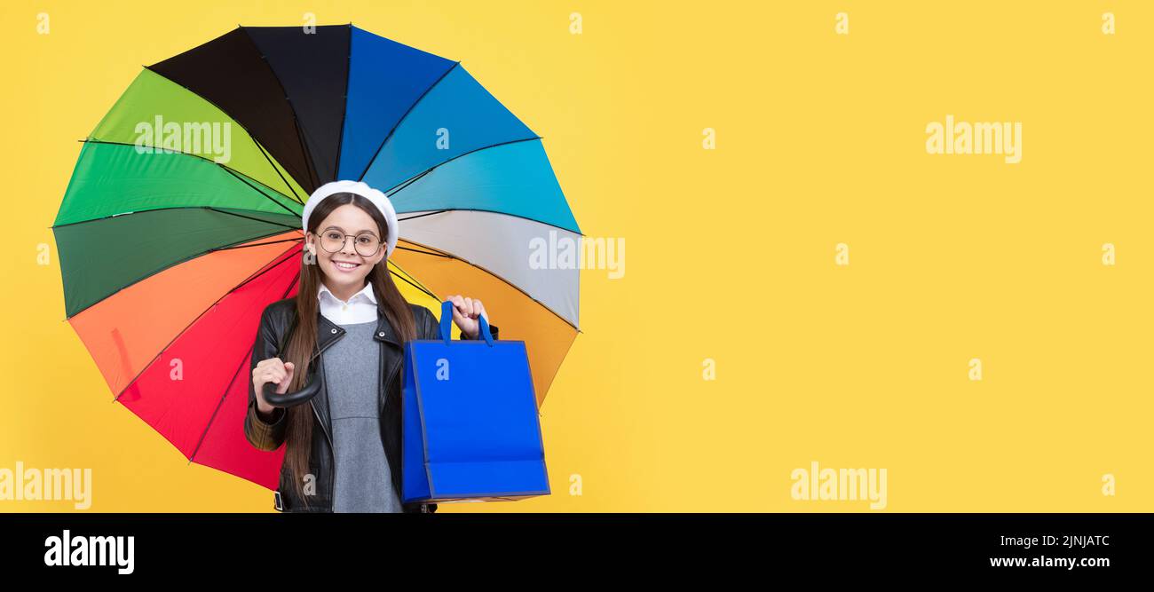 happy girl in glasses hold shopping bag. seasonal sale. teen kid under ...