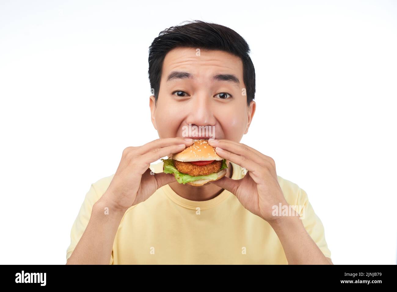 Man eating chicken burger hi-res stock photography and images - Alamy