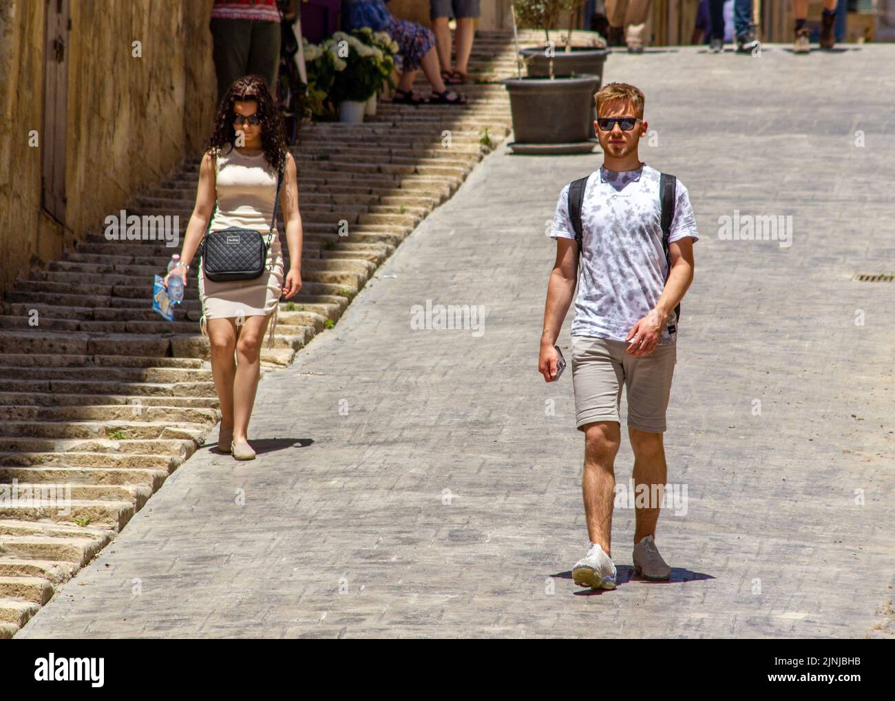 A young tourist couple walking in Valletta, Malta Stock Photo - Alamy