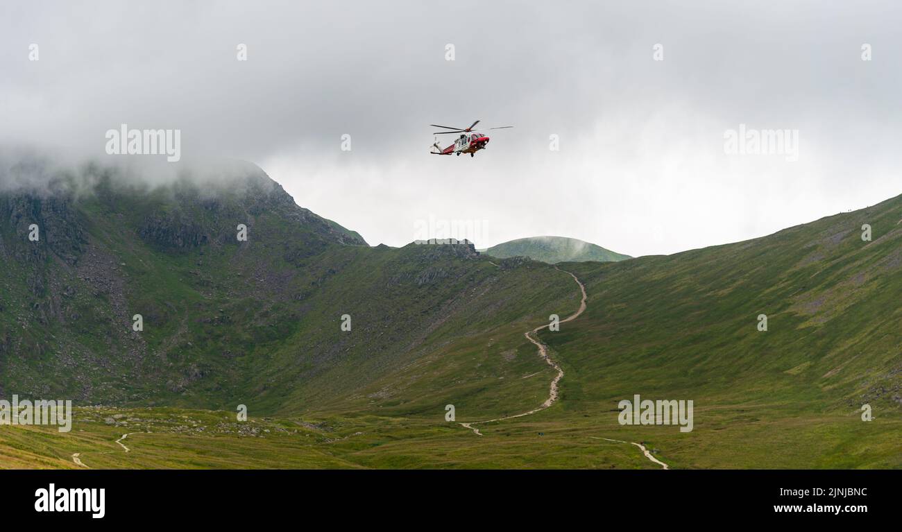 The Hm RescueGuard rescue helicopter, above Helvellyn Peak in the ...