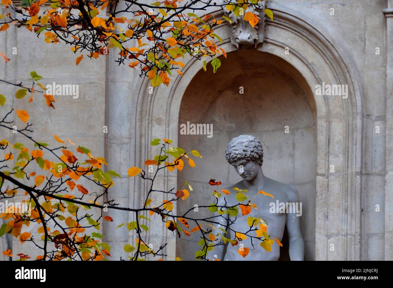 Statue in autumn Stock Photo - Alamy