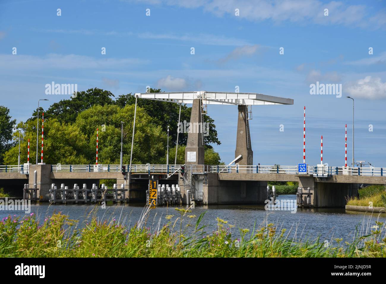 Breezand, Netherlands. August A iron lift bridge over a canal near ...