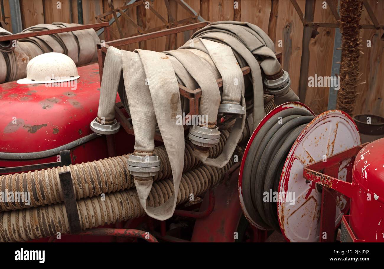 Fire hose of an old fire truck, selective focussed Stock Photo - Alamy