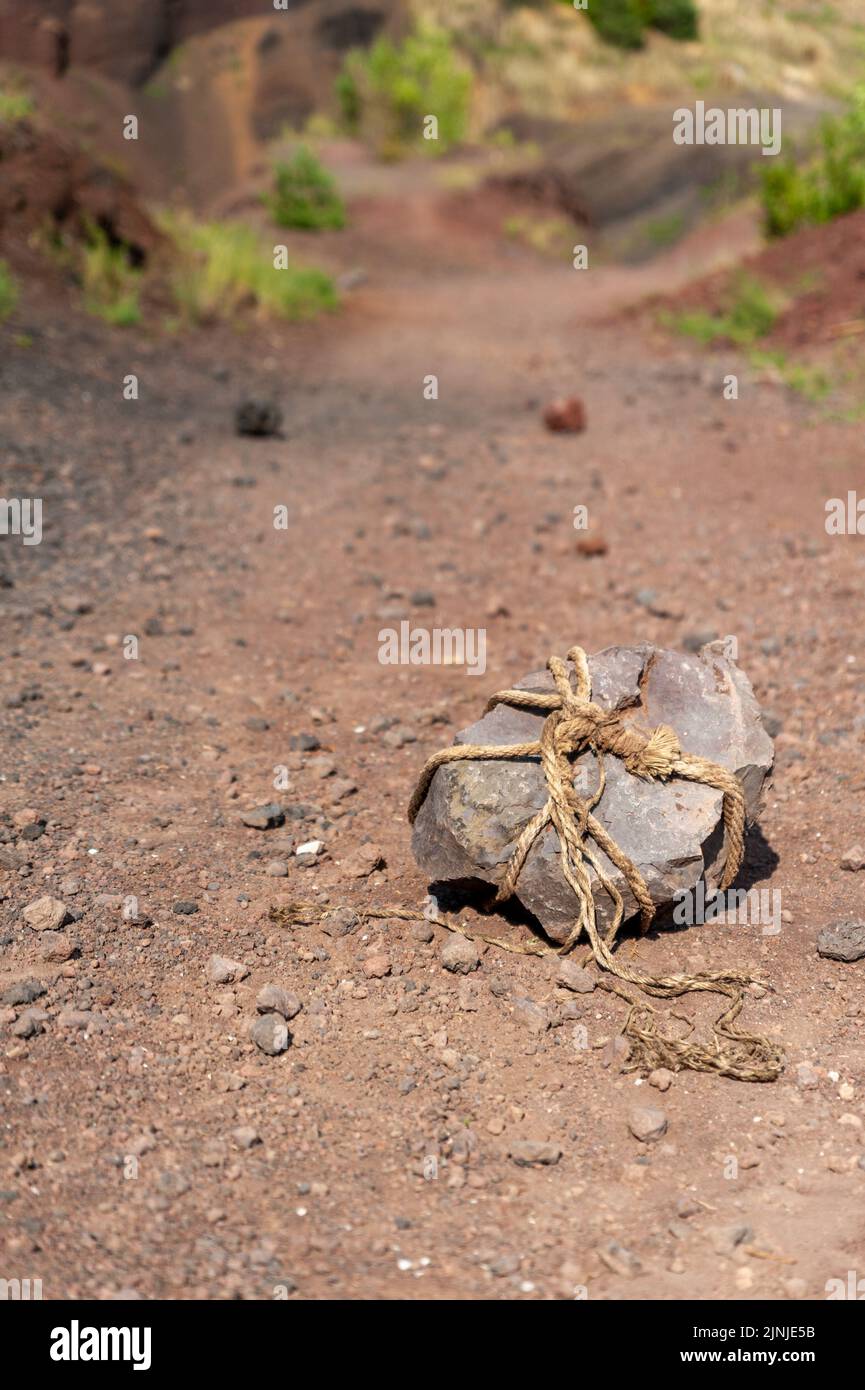 remains of rope tied on a rock, conceptual photo Stock Photo - Alamy