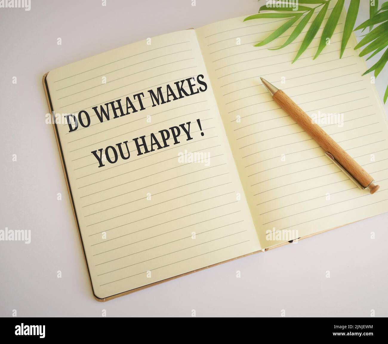 Do what makes you happy symbol. Notebook with words 'Do what makes you ...