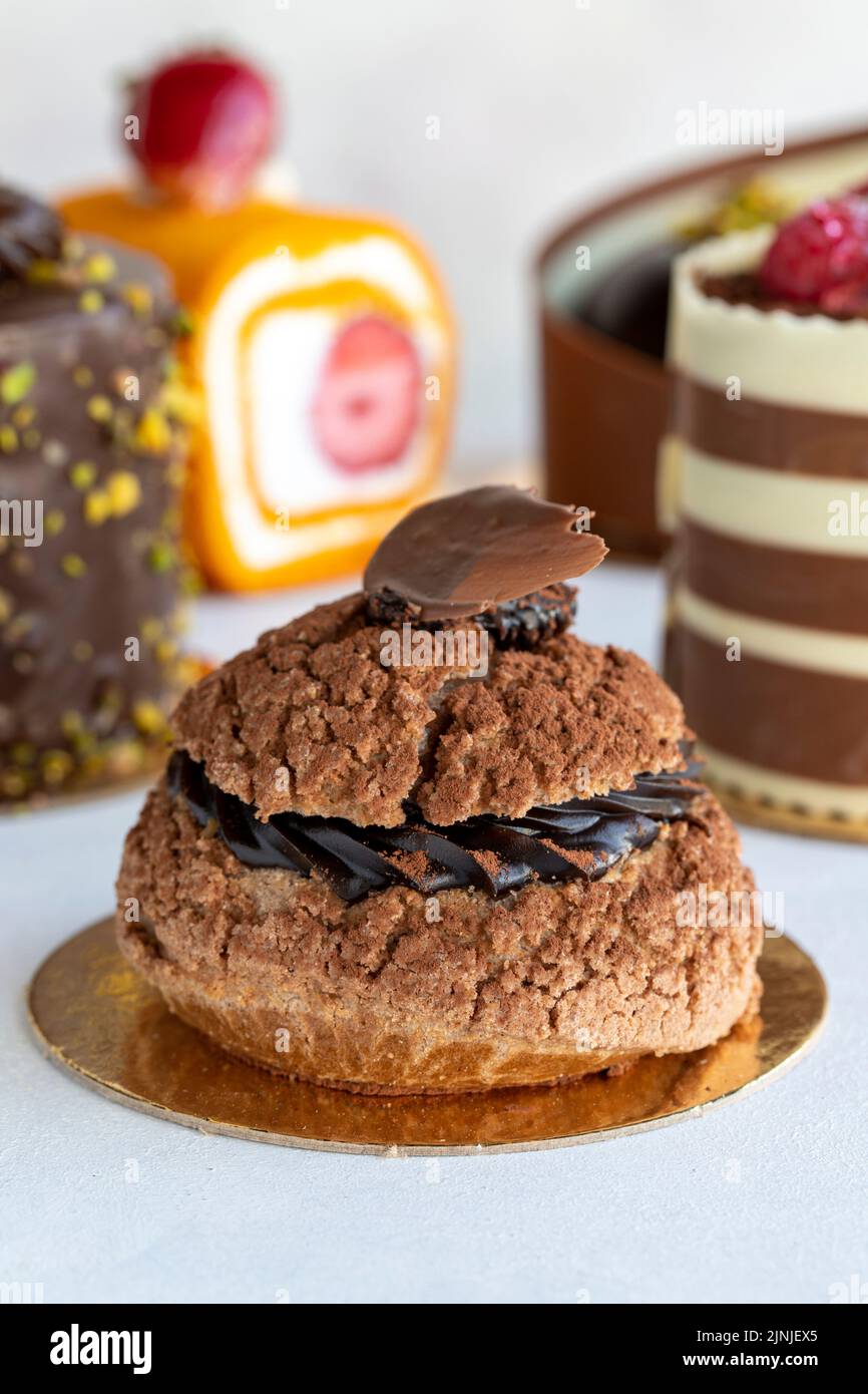 Types of cakes. Small sweet cakes on a white background. Bakery ...