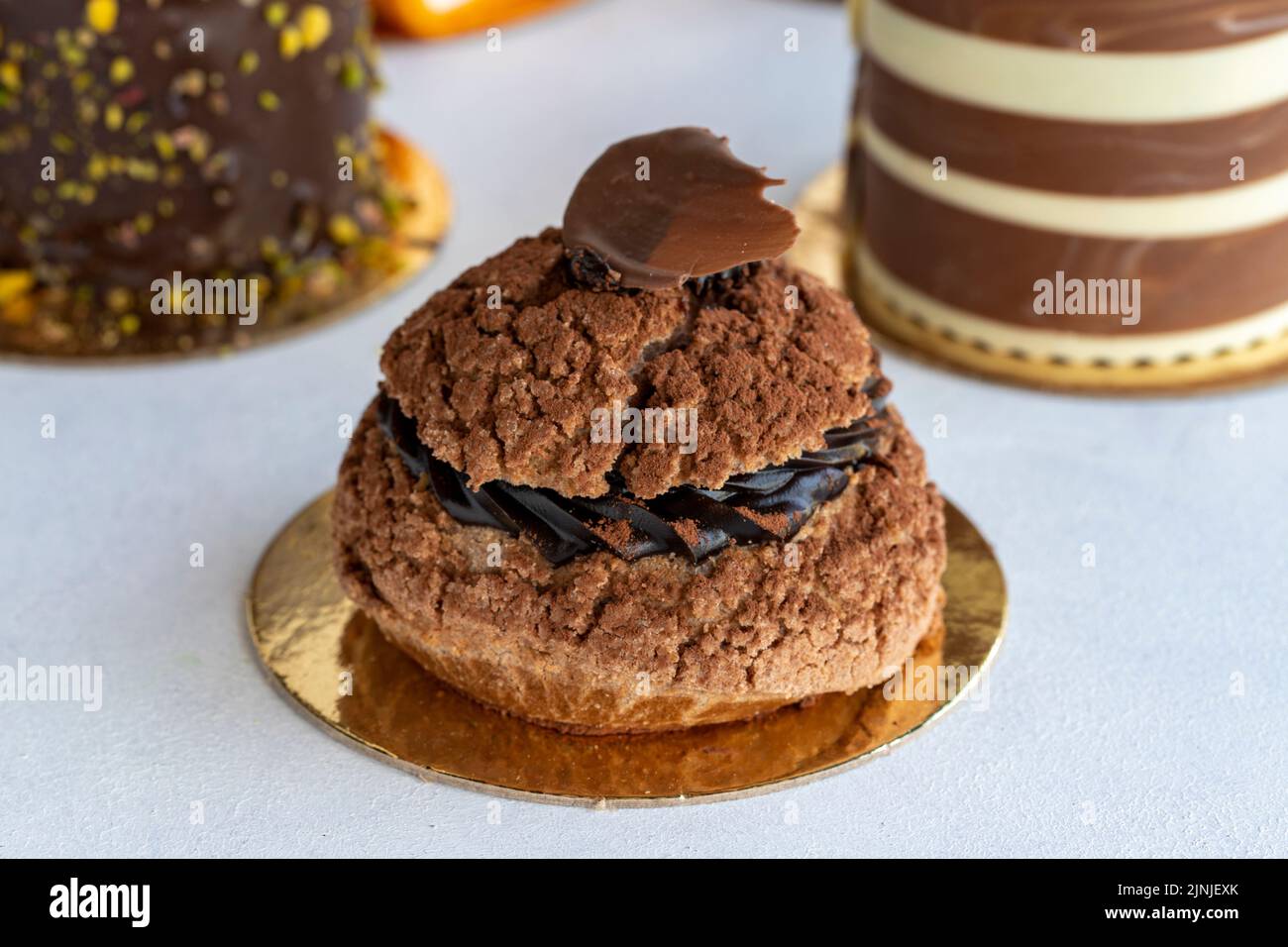 Types of cakes. Small sweet cakes on a white background. Bakery ...