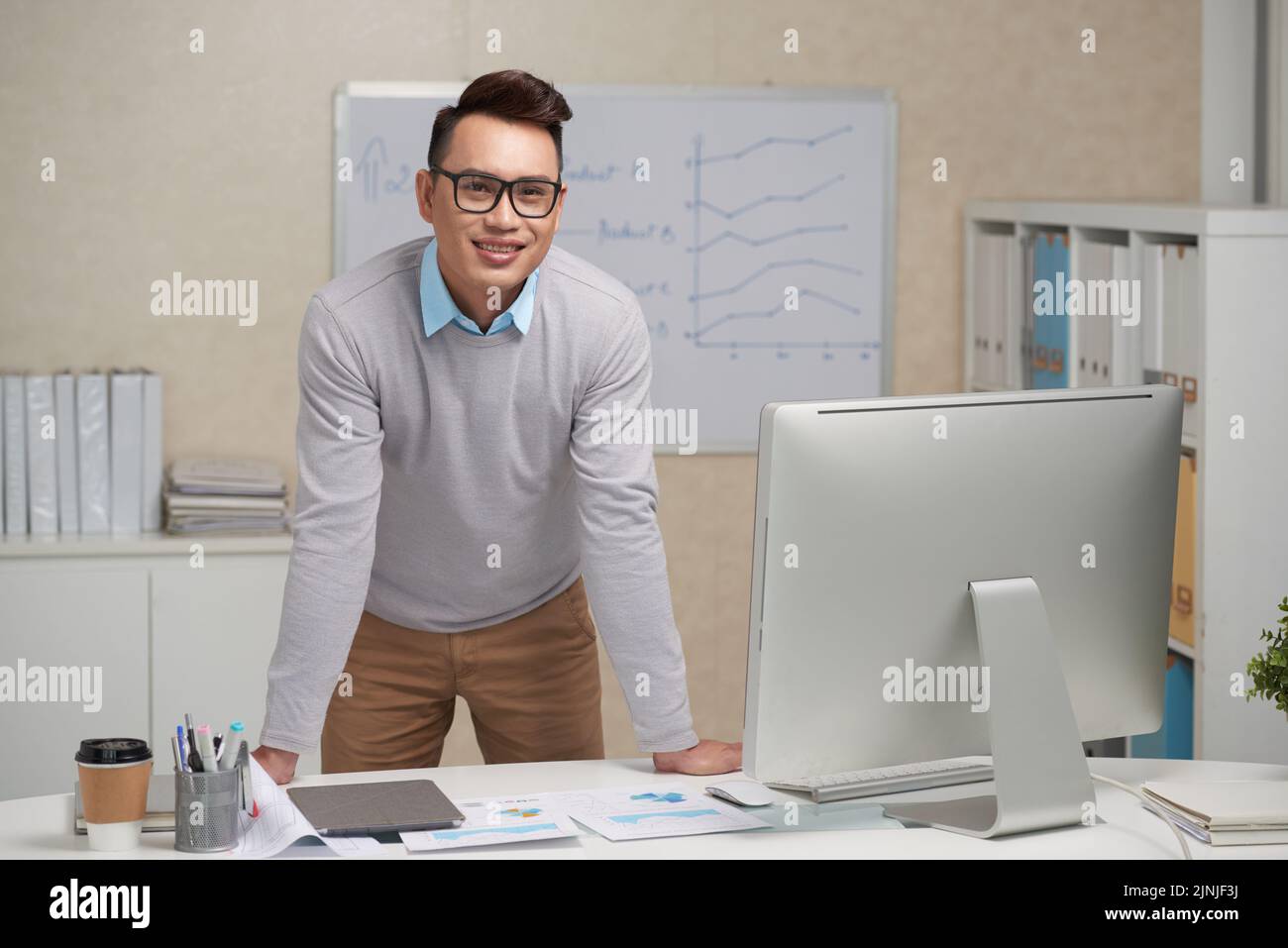 Business man leaning on table hi-res stock photography and images - Alamy