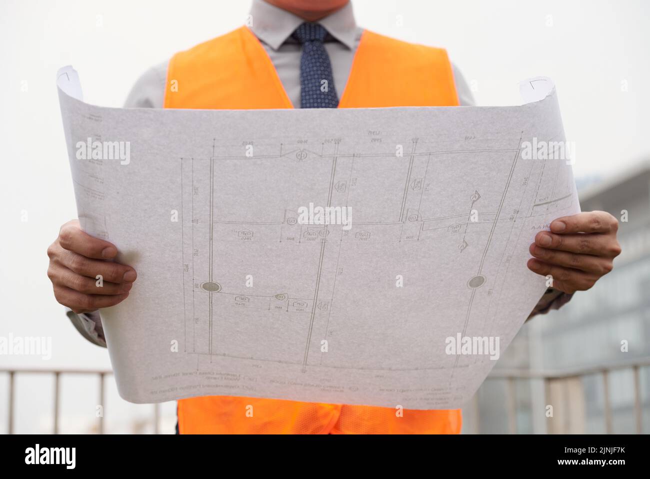 Building plan in hands of construction engineer Stock Photo - Alamy
