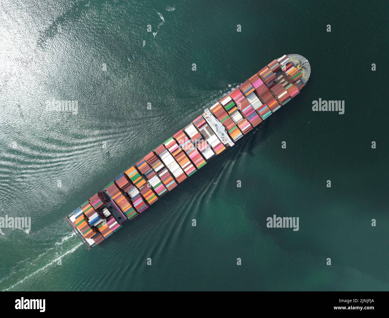 Container cargo ship, bulk transport of sea containers. Top down aerial ...
