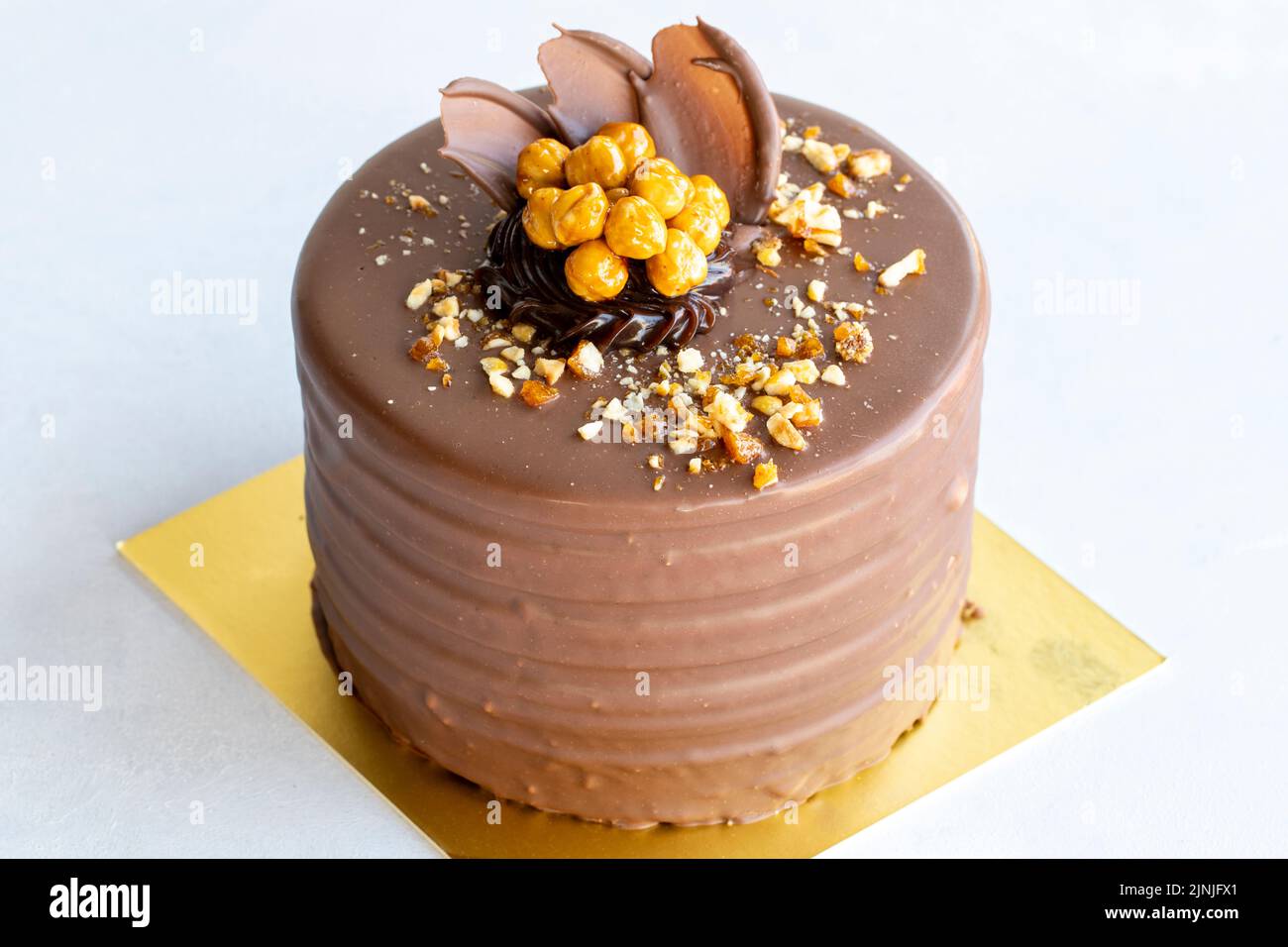 Croquant cake. Celebration cake with liquid chocolate, cream and ...
