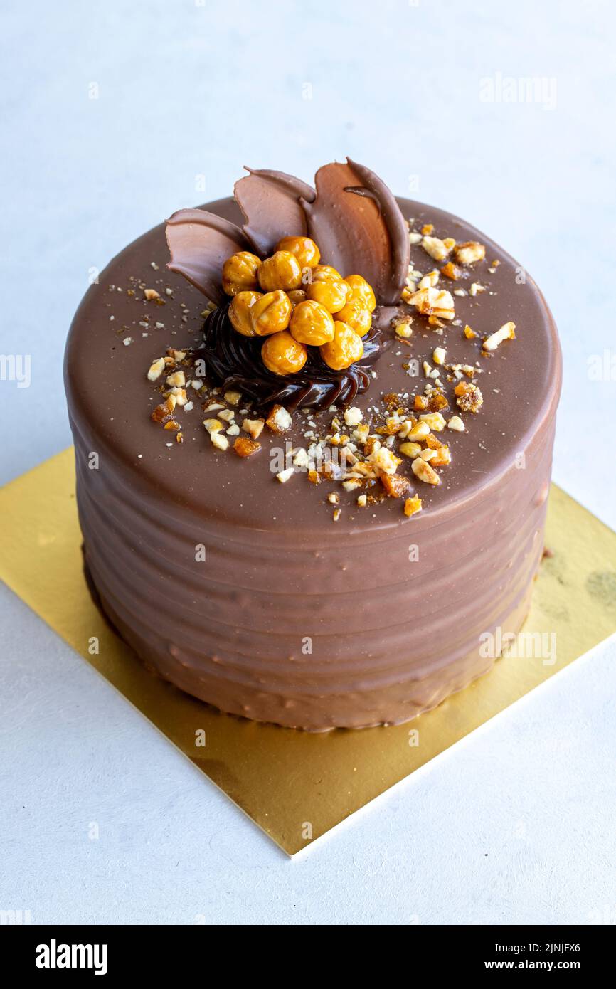 Croquant cake. Celebration cake with liquid chocolate, cream and ...