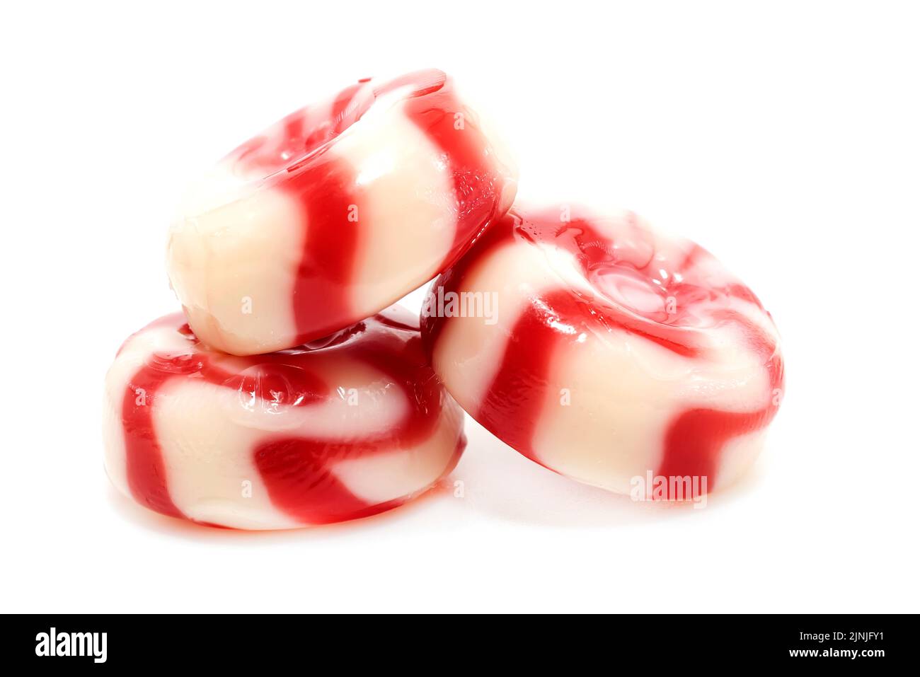 Mint candies on a white background close-up. Round shaped sweet milk ...