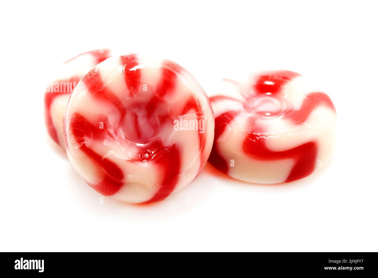 Mint candies on a white background close-up. Round shaped sweet milk ...