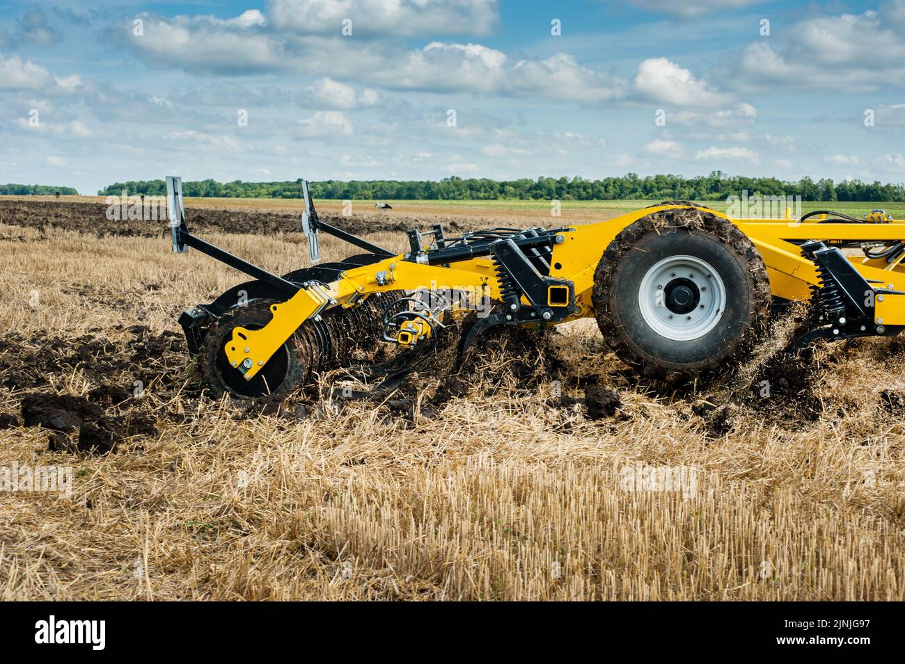 tractor with a disc cultivator, a system for processing soil in at work ...
