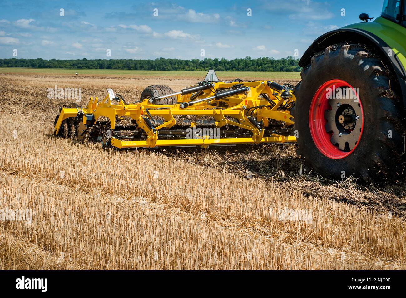 multi-disc cultivator, tillage system in operation with tractor Stock ...