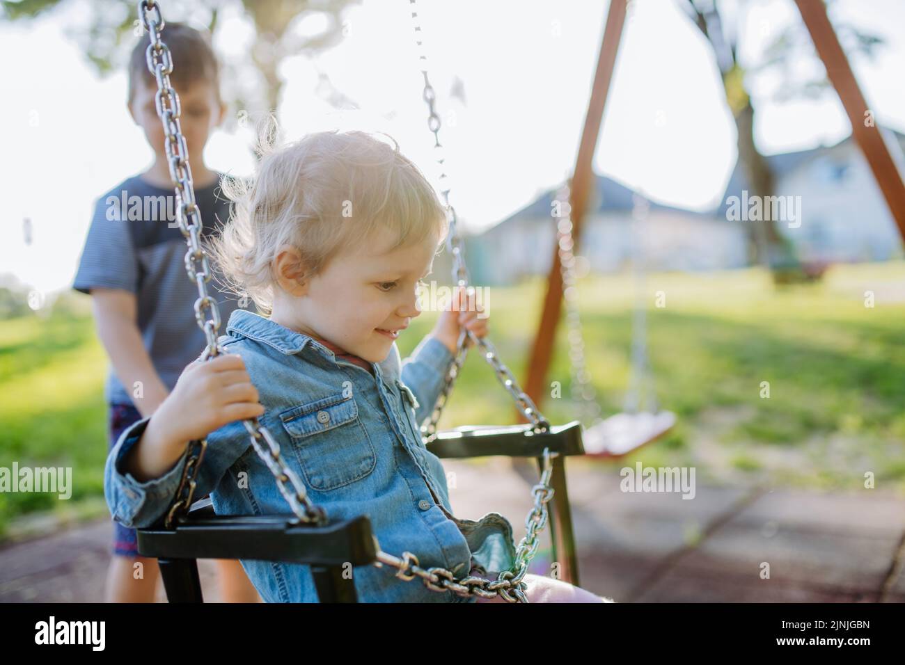 Children together playground hi-res stock photography and images - Alamy