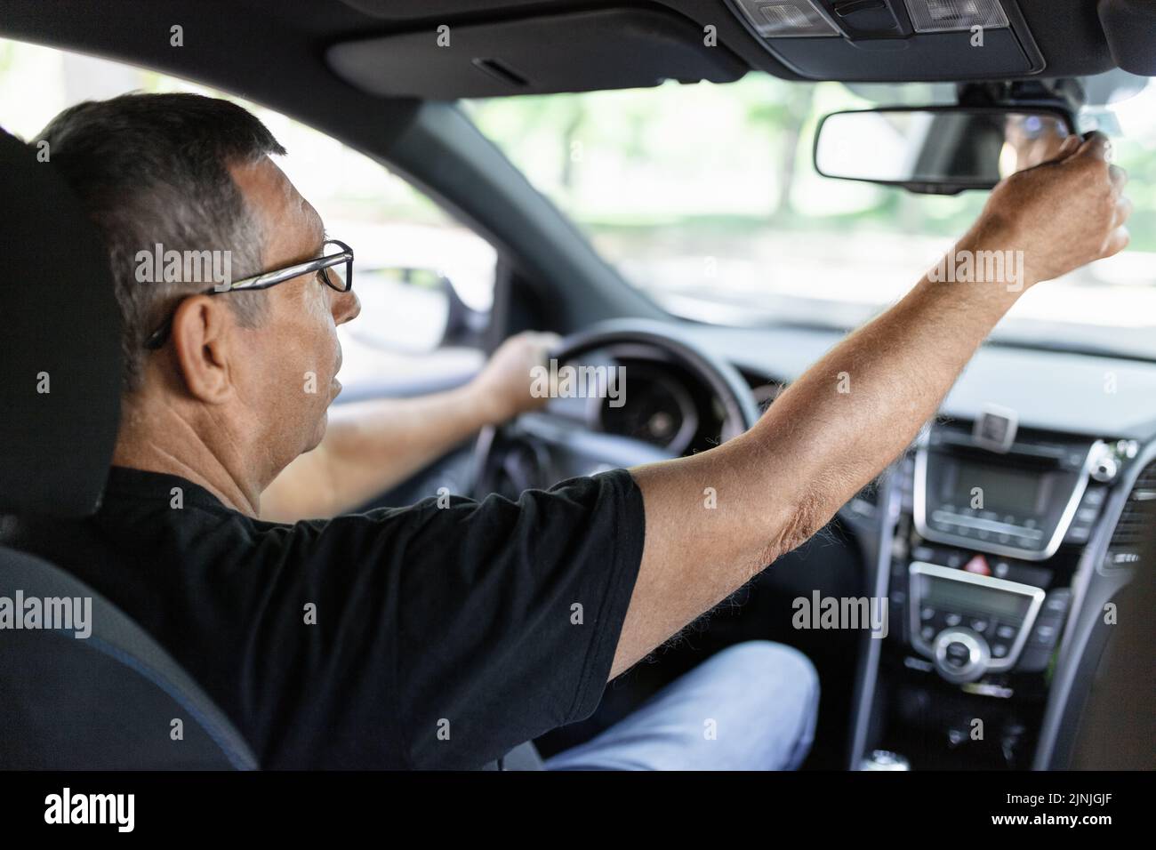 Happy senior in his 70s driving a car Stock Photo - Alamy