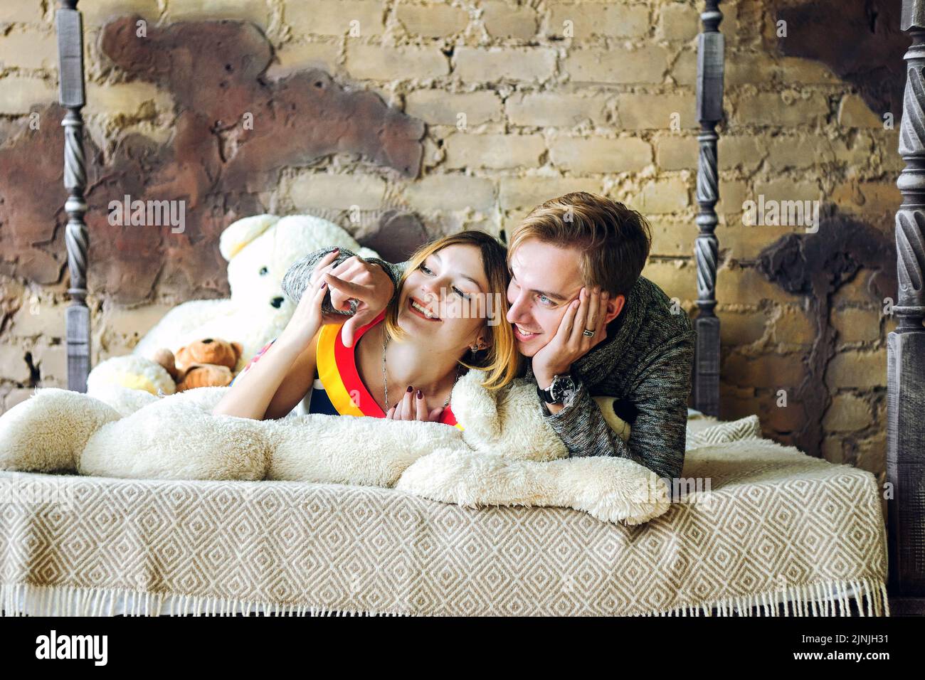 Love story of young happy, funny couple in studio, cozy home. Family ...