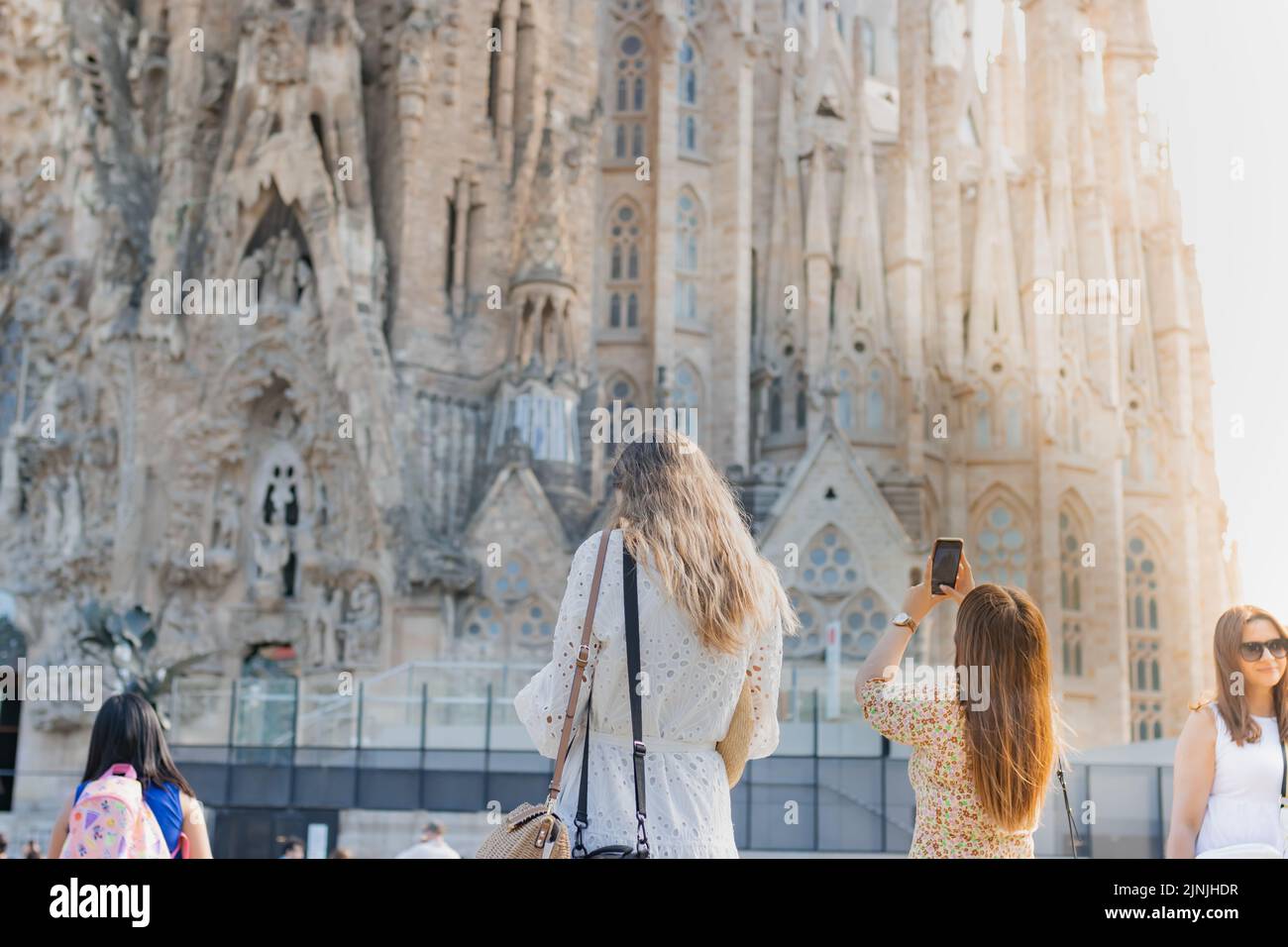 Barcelona, Spain - July 1, 2022: two girls on vacation in front of the ...
