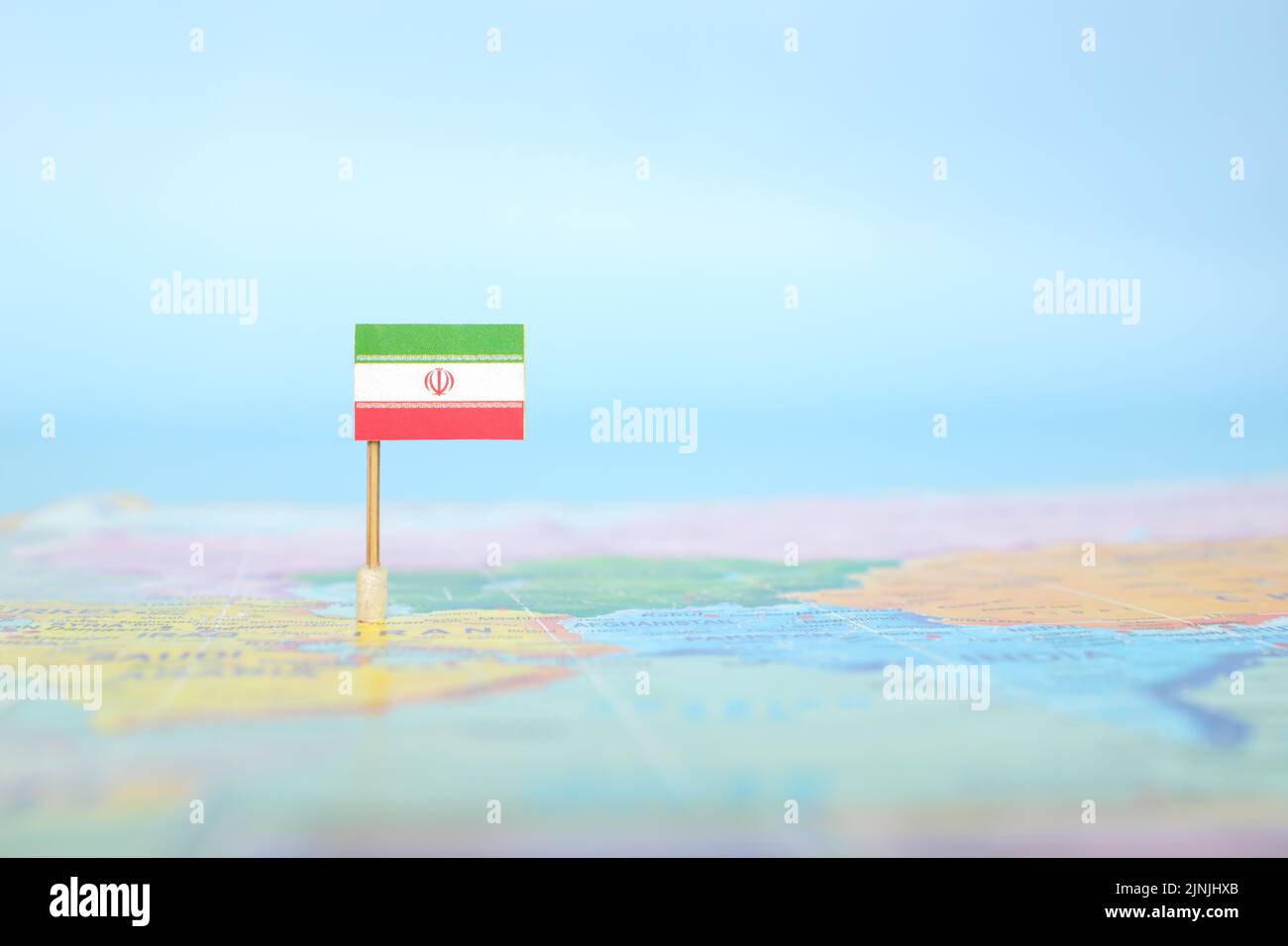 Selective focus of Iranian flag in world map. Iran country location and ...